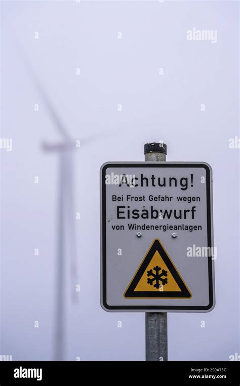 Sign Warns Of Ice Shedding From Wind Turbines In Frost Ice Deposits Can Form On The Rotors