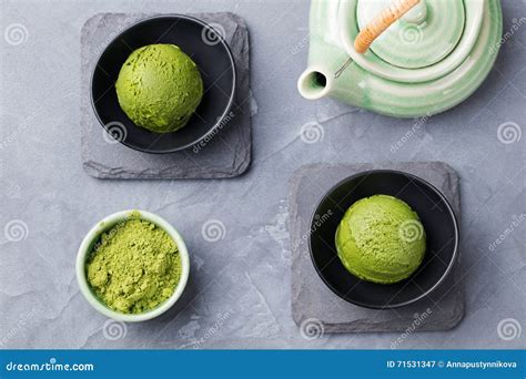 Green Tea Matcha Ice Cream Scoop In Bowl On A Grey Stone Background Top