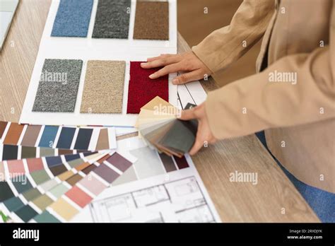 Architectural Concept Female Architect Choosing Color On Color Swatch For House Interior Design