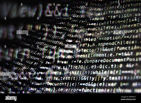 White Program Source Code Segments On Black Screen Macro Closeup Stock