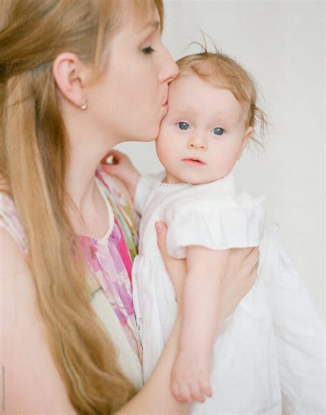 Mother Holding Baby By Stocksy Contributor Milles Studio Stocksy
