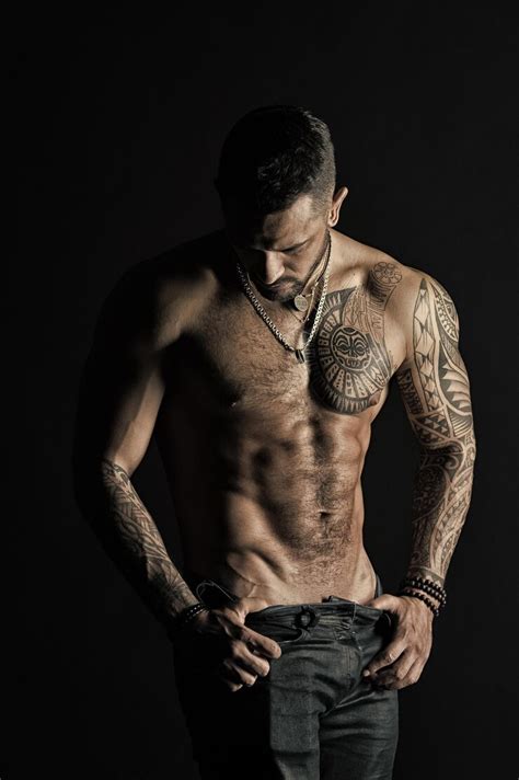 Premium Photo Fashion Man With Tattoo Take Off Jeans Man Stripper
