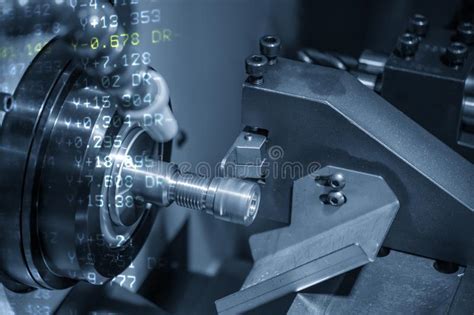 The Abstract Scene Of CNC Lathe Machine Cutting The Thread At The Metal Shaft Stock Image