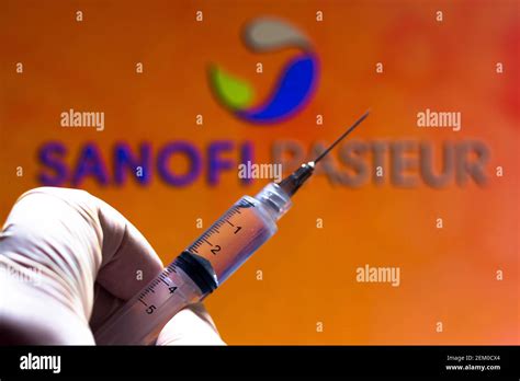 In This Photo Illustration The Medical Syringe Is Seen With Sanofi Pasteur Company Logo
