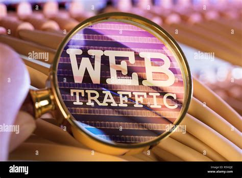 Hand Analyzing Web Traffic Through Magnifying Glass Over Cables Stock