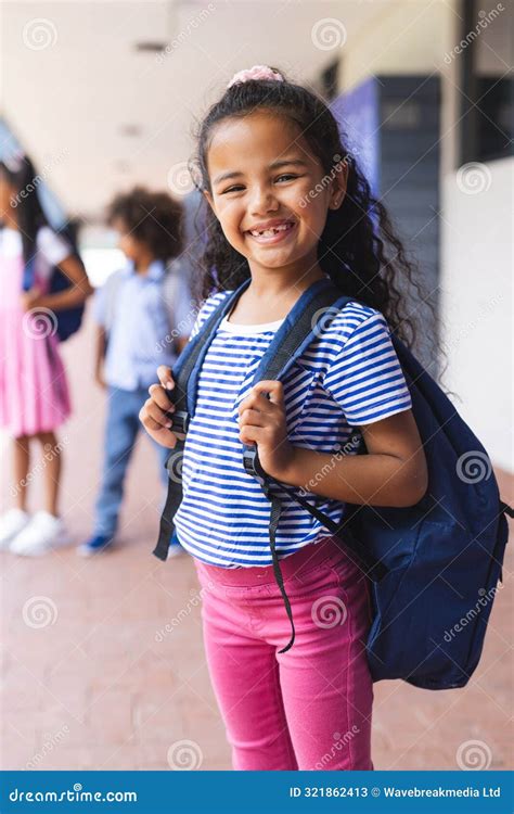 Biracial Girl Smiling With Backpack Ready For School Stock Image