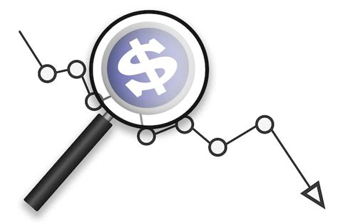 Premium Photo Chart With Down Arrow And Dollar Symbol Under Magnifying Glass