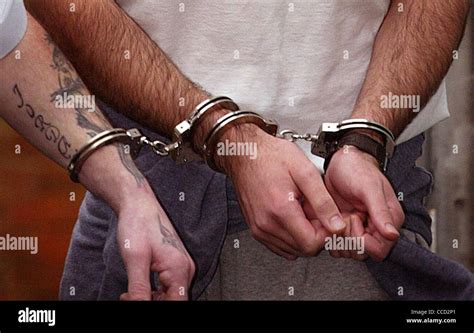 A Prisoner In Handcuffs Is Taken Into Custody Picture By James