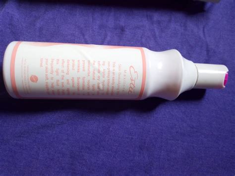 Review Caring Estée Maxitone Skin Beautifying Milk With Alpha