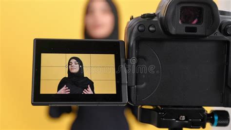 camera screen arabic woman in black hijab recording video blog vlog
