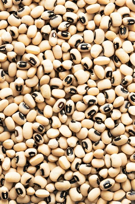 A Close Up Of A Bunch Of Black And White Beans Photo Bean Image On
