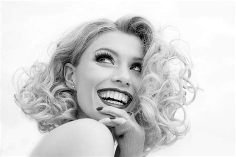 Premium Photo Pinup Retro Girl With Curly Hair Winking Smiling And