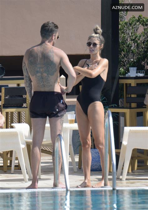 Chloe Sims Talks To A Tattooed Sam Mucklow By The Pool At A Hotel In