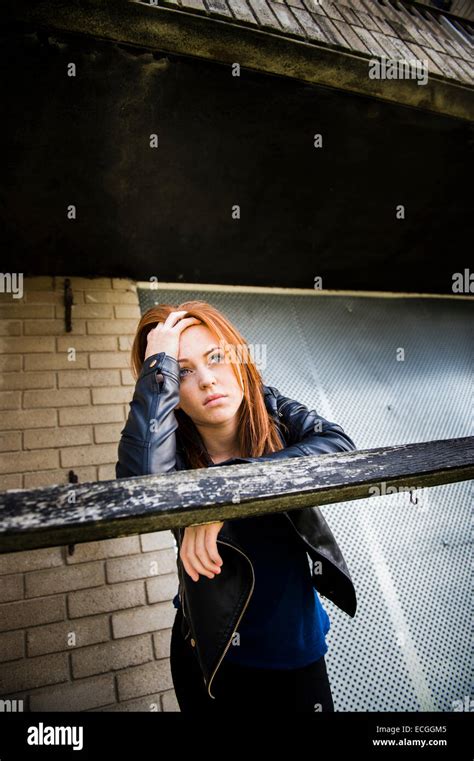 A Moody Solo Redhead Ginger Haired Young Woman Teenager Girl Alone By