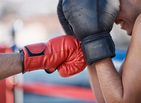 Premium Photo Punch Boxing Gloves Or Men Fighting In Sports Training