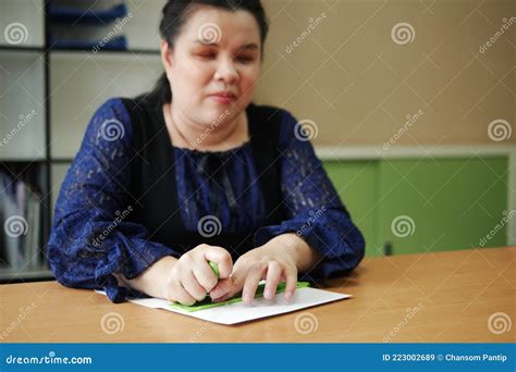 Asian Blind Person Woman Using Vintage Braille Typewriter Or Brailler For People With Vision