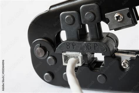 Crimping Tool With A Computer Network Cable On White Background Crimping Pliers Closeup Stock