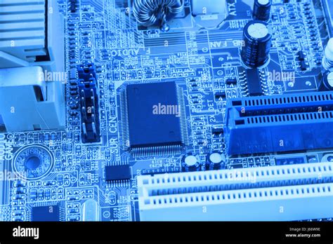 Integrated Semiconductor Microchip Microprocessor On Blue Circuit Board Representative Of The