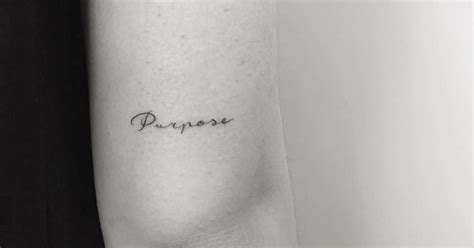 Word Purpose Lettering Tattoo Located On The Tricep