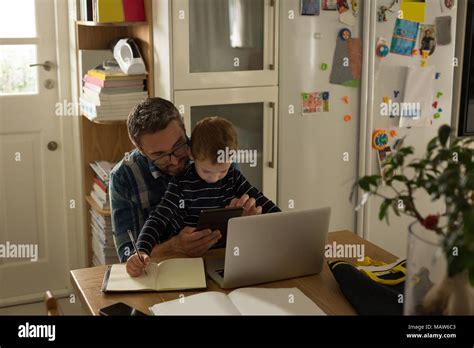 Father Son Using Touchscreen Tablet Hi Res Stock Photography And Images Alamy