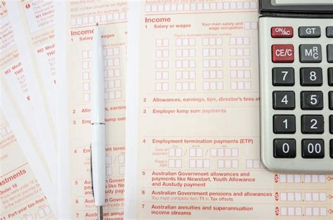 Premium Photo Australian Tax Forms With Calculator And Pen
