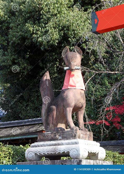 Two Statues Of Foxes Inari Deity Of Rice In The Shinto Shrine Of