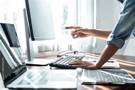 Asian Woman Programmer Pointing Code Data On Screen Laptop While Working To Writing Code Data