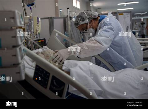 A Health Worker Treats A Covid Patient At The Intensive Care Unit Of The Dr Ernesto Che