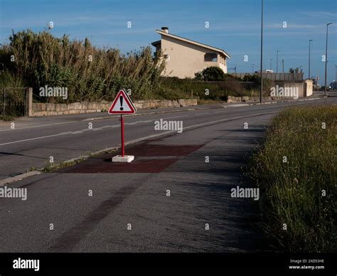 A Traffic Sign Exclamation Mark Warning Road Sign With An Exclamation Mark In Red Triangle On