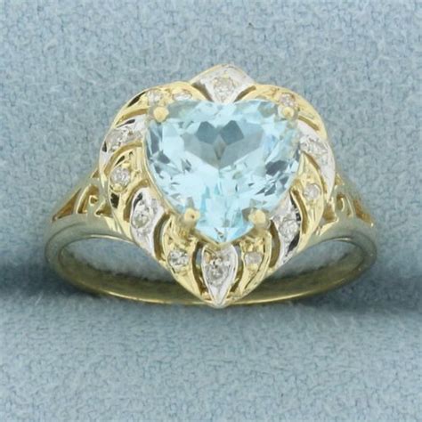 Heart Shaped Blue Topaz And Diamond Ring In 14k Yellow And White Gold