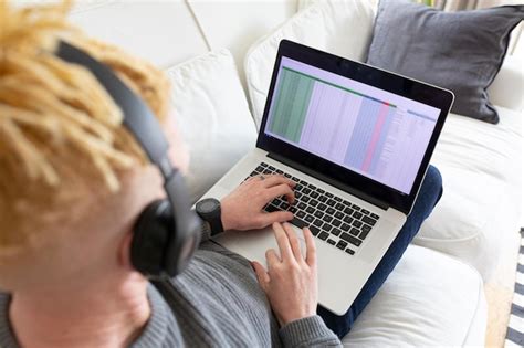 Premium Photo Albino African American Man In The Living Room Using Laptop