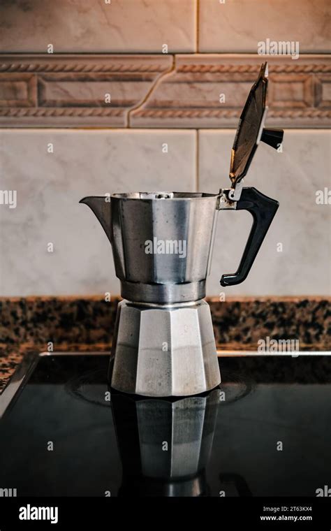 Close Up Of Stainless Steel Stovetop Espresso Maker Placed On Sleek