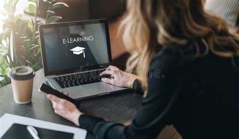 Rear View Young Woman Is Working On Laptop With Inscription On Screen
