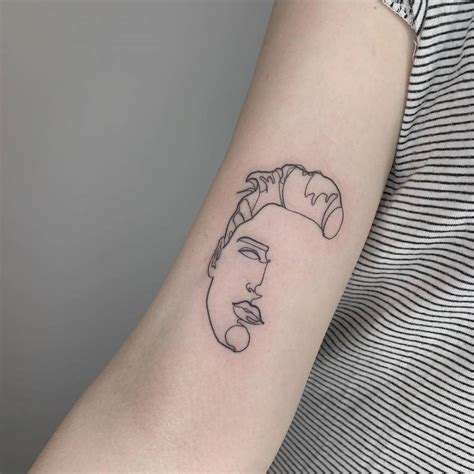 Line Art Elvis Portrait Tattoo On The Bicep