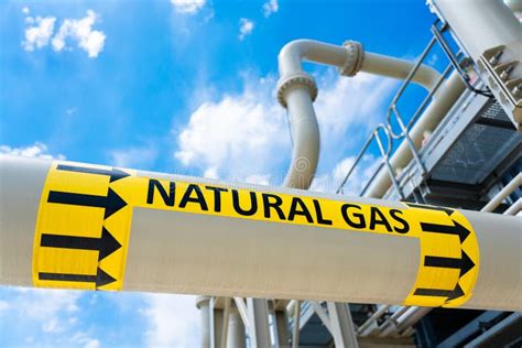 high pressure gas pipeline with flow direction sign at compressor