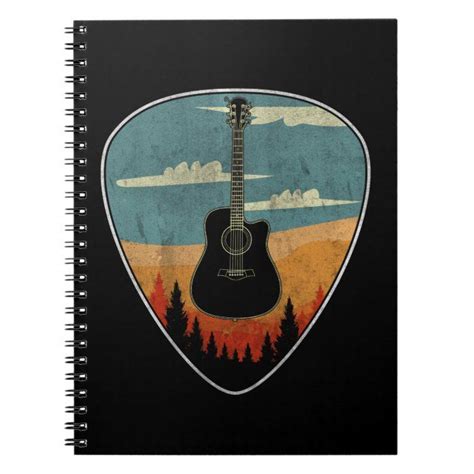 A Black Guitar Picker With Trees And Sky In The Background Spiral