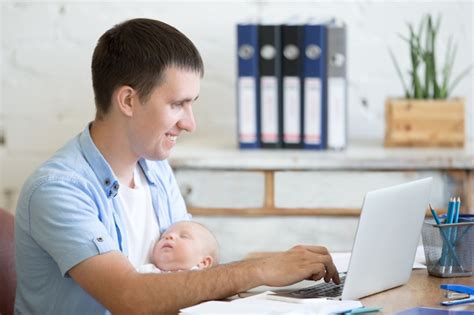 Premium Photo Man With A Baby And A Laptop