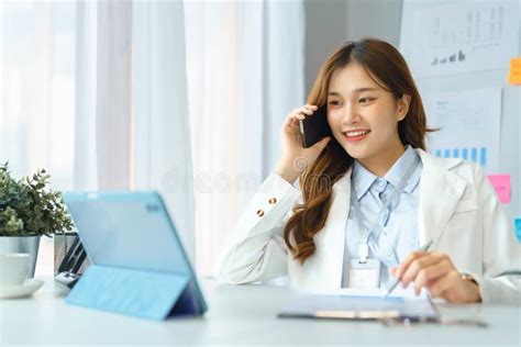 Successful Business Concept Businesswoman Talking On Smartphone And Looking Data On Tablet