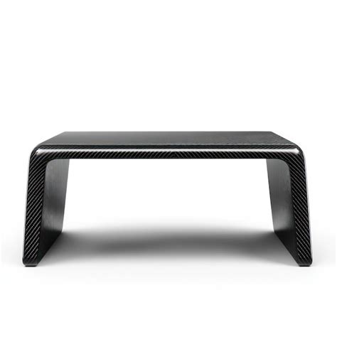 A Small Black Table With A Black Top Sits Against A White Background