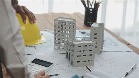 Architectural Engineer Team Meeting Use Of Blueprints Construction