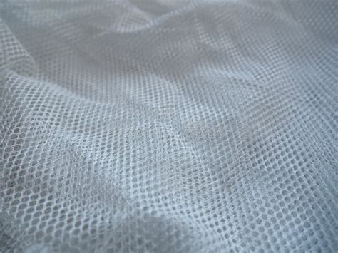 Sheer White Net Like Tulle Mesh Fabric Is Wrinkled Or Folded Carelessly Close Up Stock Photo