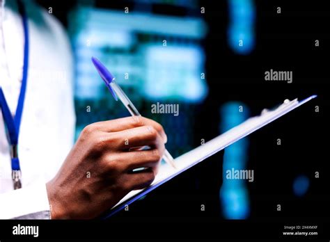 Technician Performing Diagnostic Assessments On Server Rigs To Detect Problems With Data Center