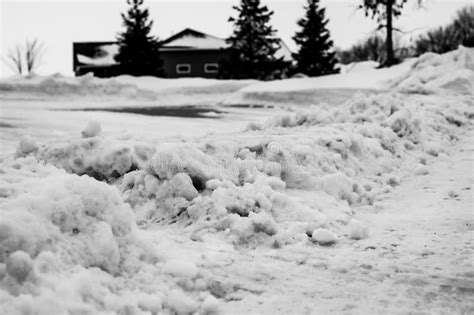 Snowbank At The End Of A Driveway Left After City Snowplows Cleared A