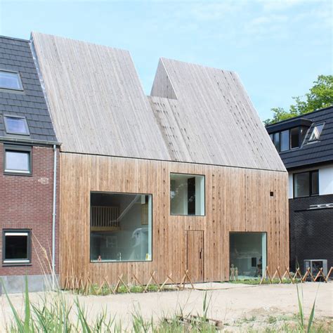 Mjölk Architekti Updates Cottage With Burnt Wood Cladding And Revamped