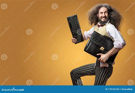 Portrait Of A Skinny Nerd Holding A Keyboard And A Briefcase Stock Photo Image Of Keyboard