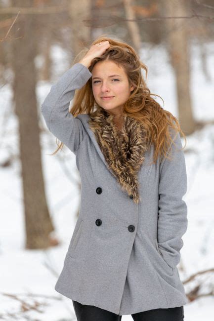 Stylish Woman In Outerwear Standing In Forest On Winter Day · Free