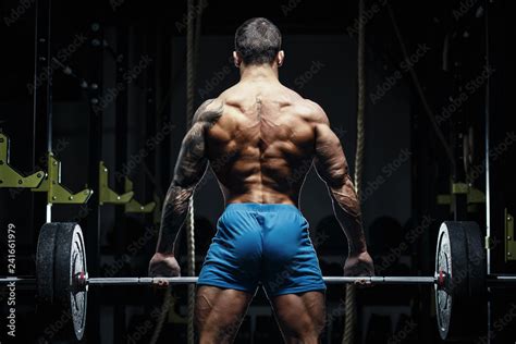 Muscular Man Bodybuilder Training In Gym And Posing Fit Muscle Guy