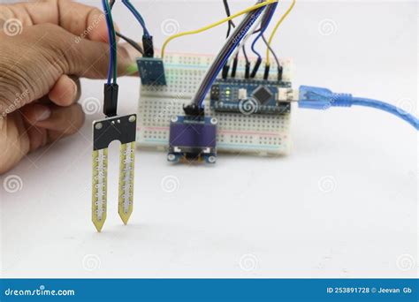 Breadboard Circuit Made From Display Module And Microcontroller Board Connected With Wires Shows