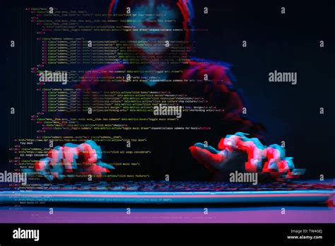 Hacker Working With Computer In Dark Room With Digital Interface Around