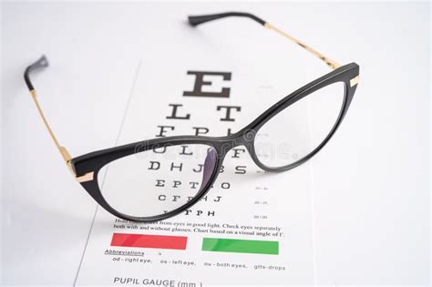Glasses On Eye Testing Exam Chart To Check Eyesight Accuracy Of Reading